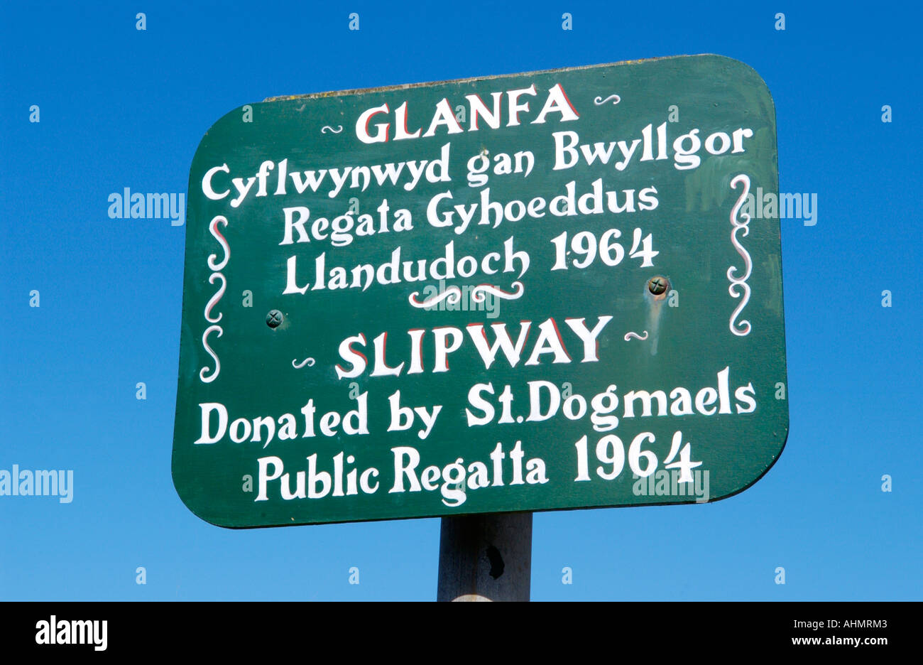 Homemade bilingual Welsh English language sign on slipway on River ...