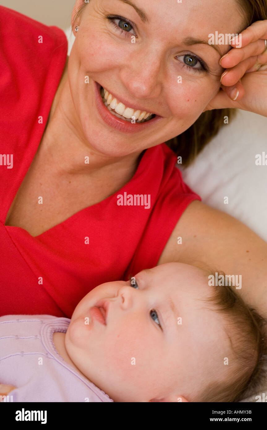 Mother And 5 Month Old Baby Lying On Bed Stock Photo Alamy mother-and-5-month-old-baby-lying-on-bed-stock-photo-alamy
