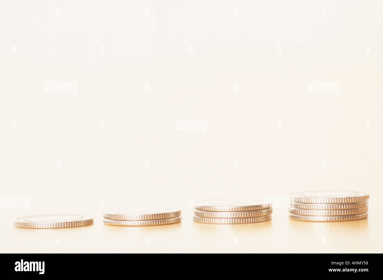 Three stacks of pound coins hi-res stock photography and images - Alamy