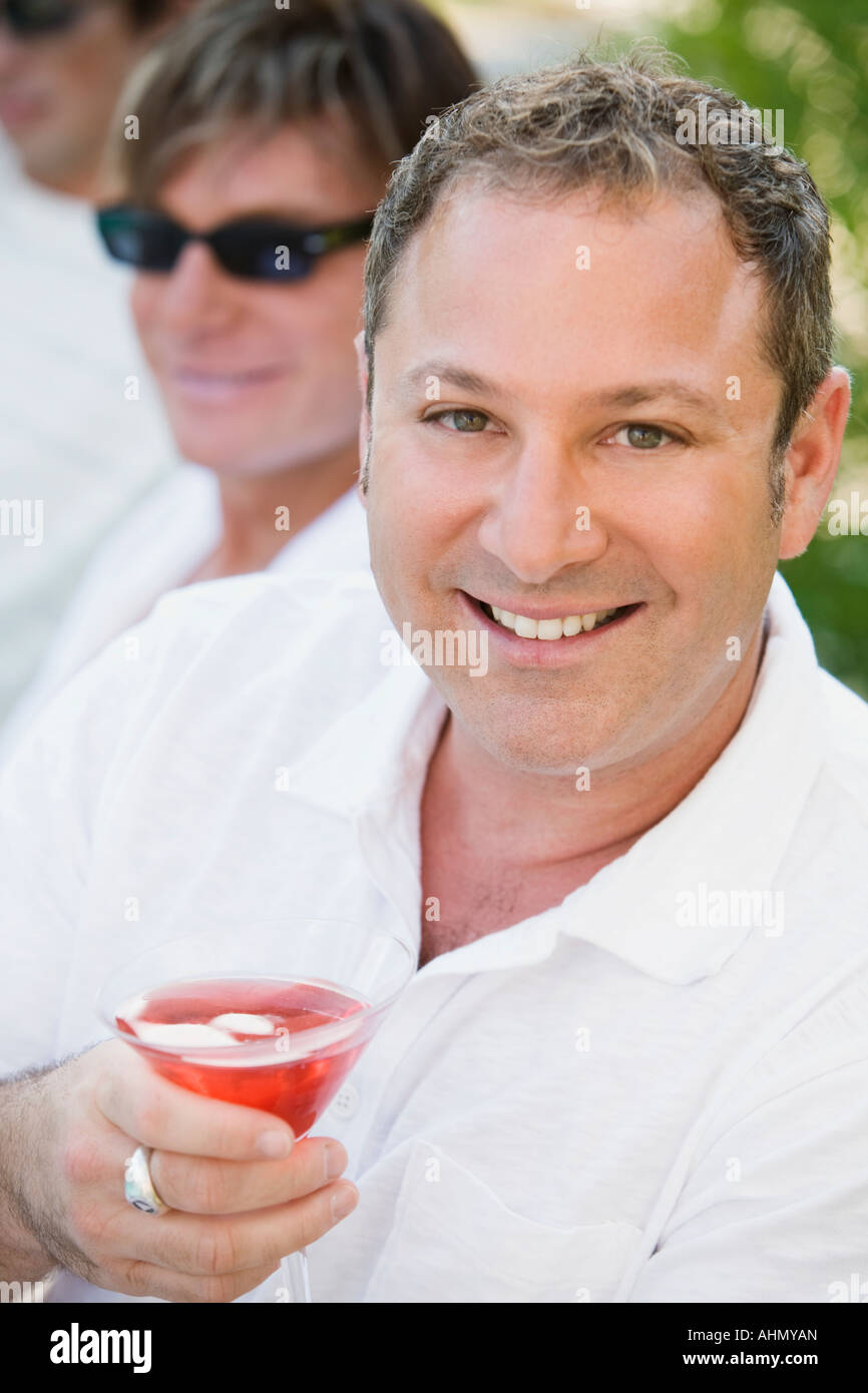 Man relaxing with drink Stock Photo - Alamy