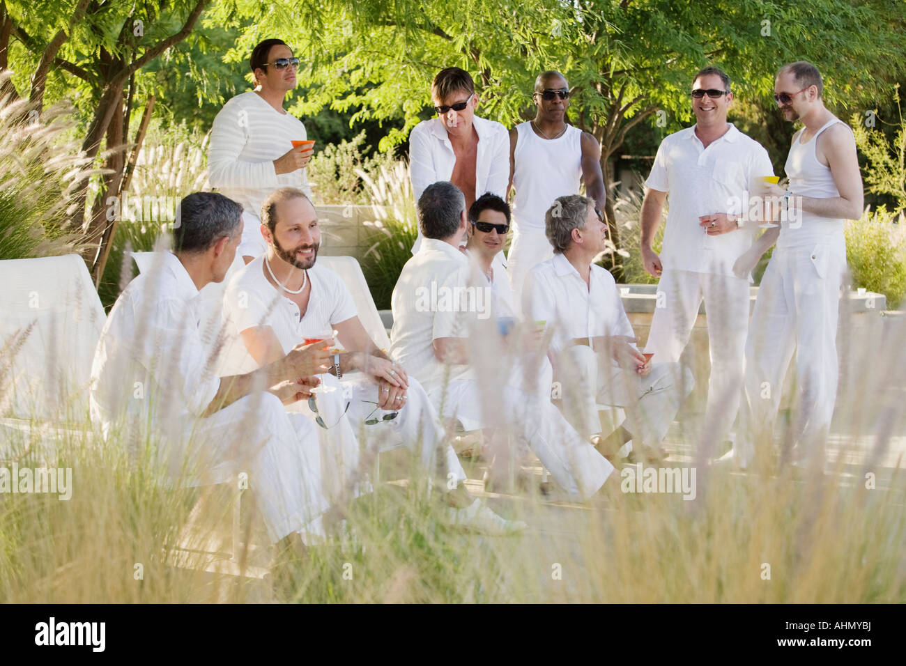 Men socializing outdoors Stock Photo - Alamy