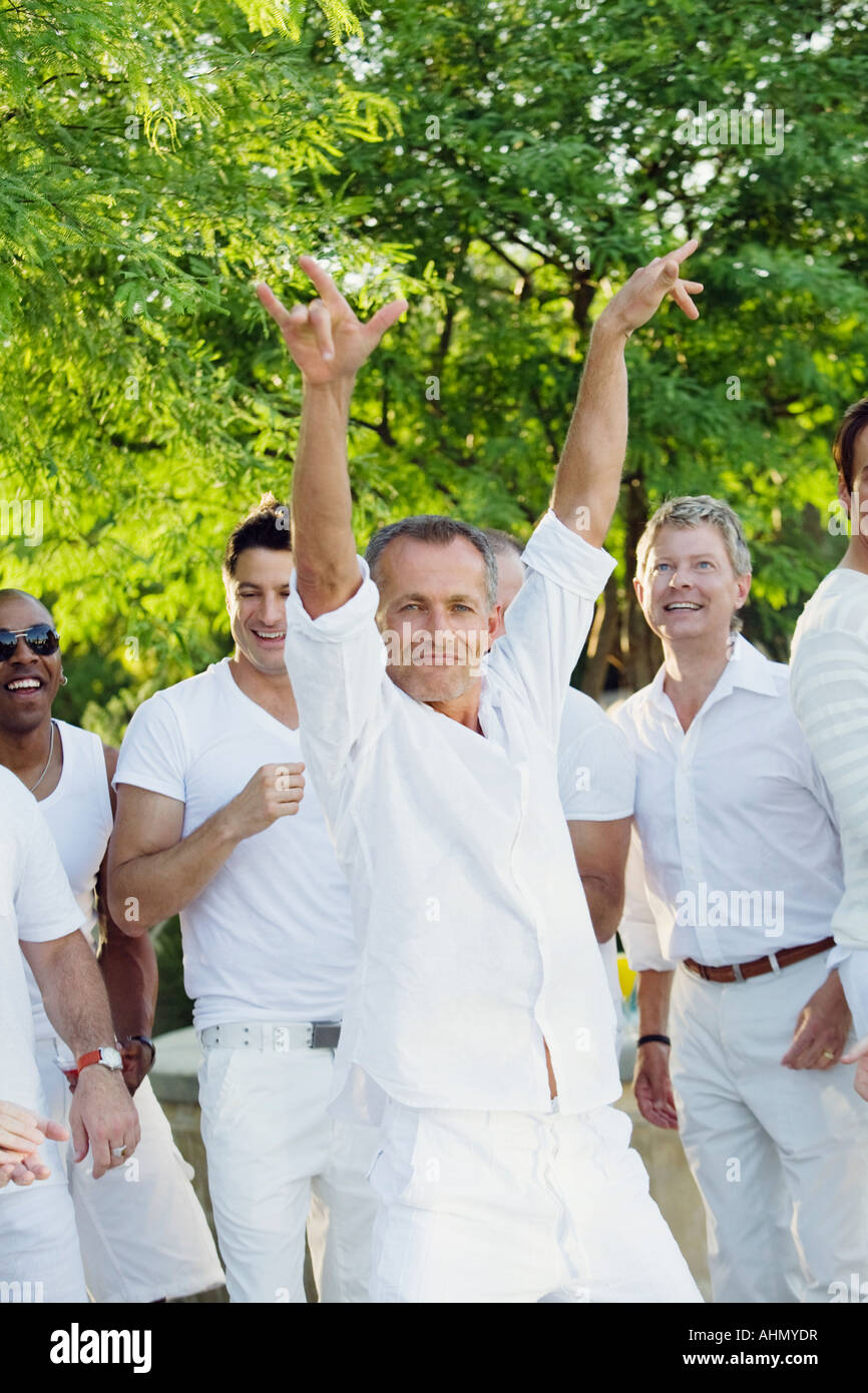 Men dancing by swimming pool Stock Photo - Alamy