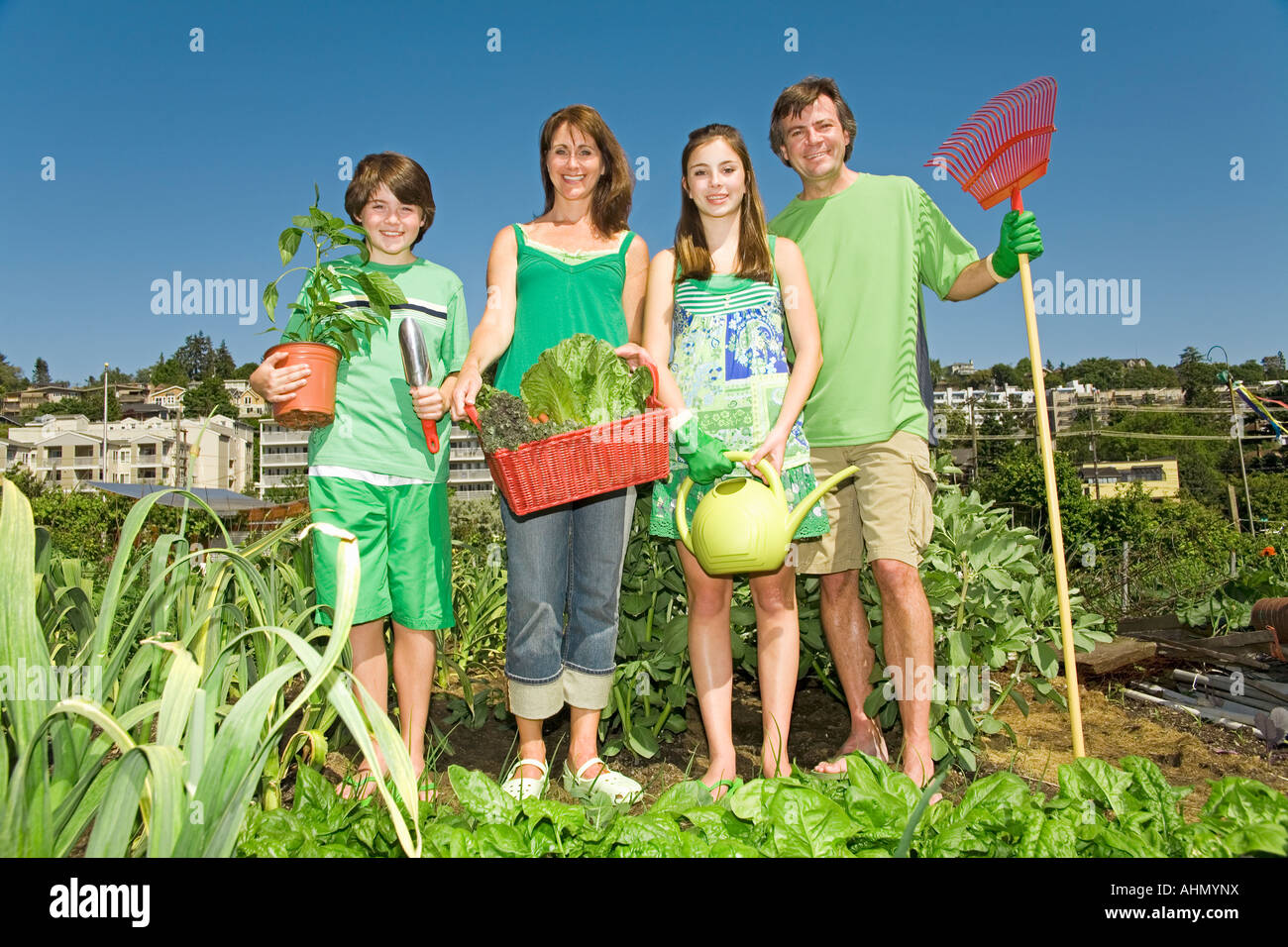 Family in vegetable garden Stock Photo - Alamy