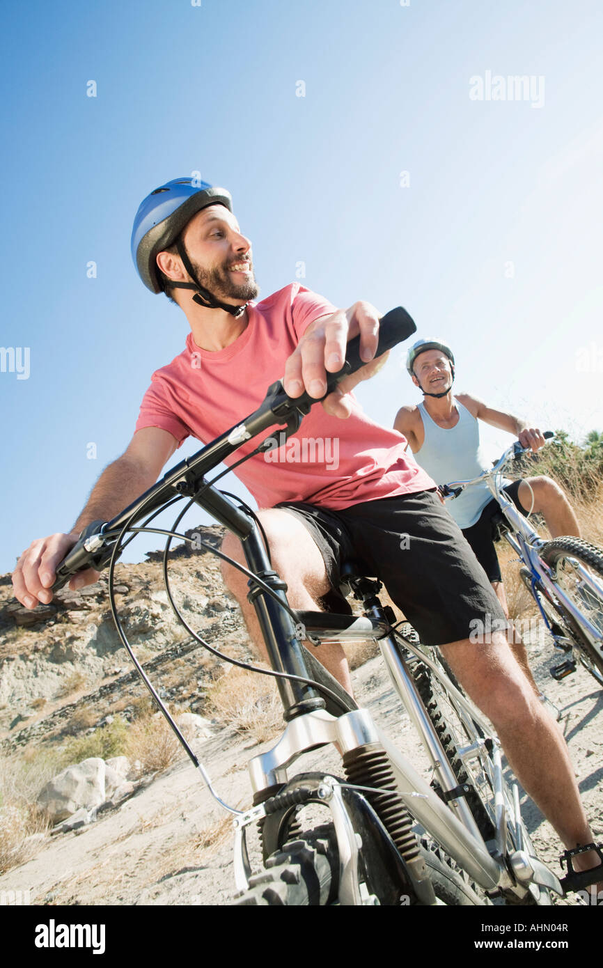 Men mountain biking together Stock Photo - Alamy