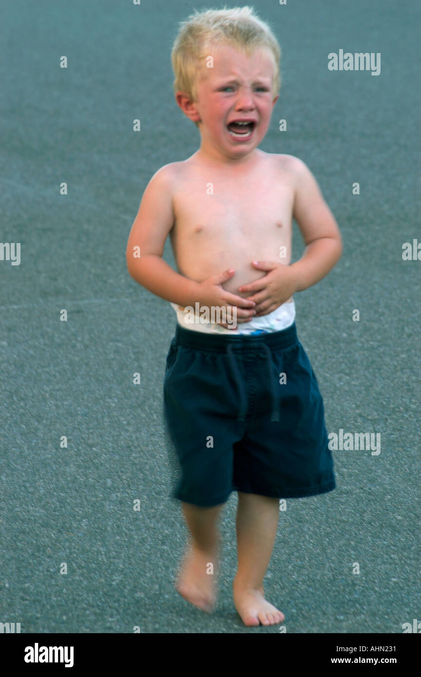 upset child crying in street Stock Photo - Alamy