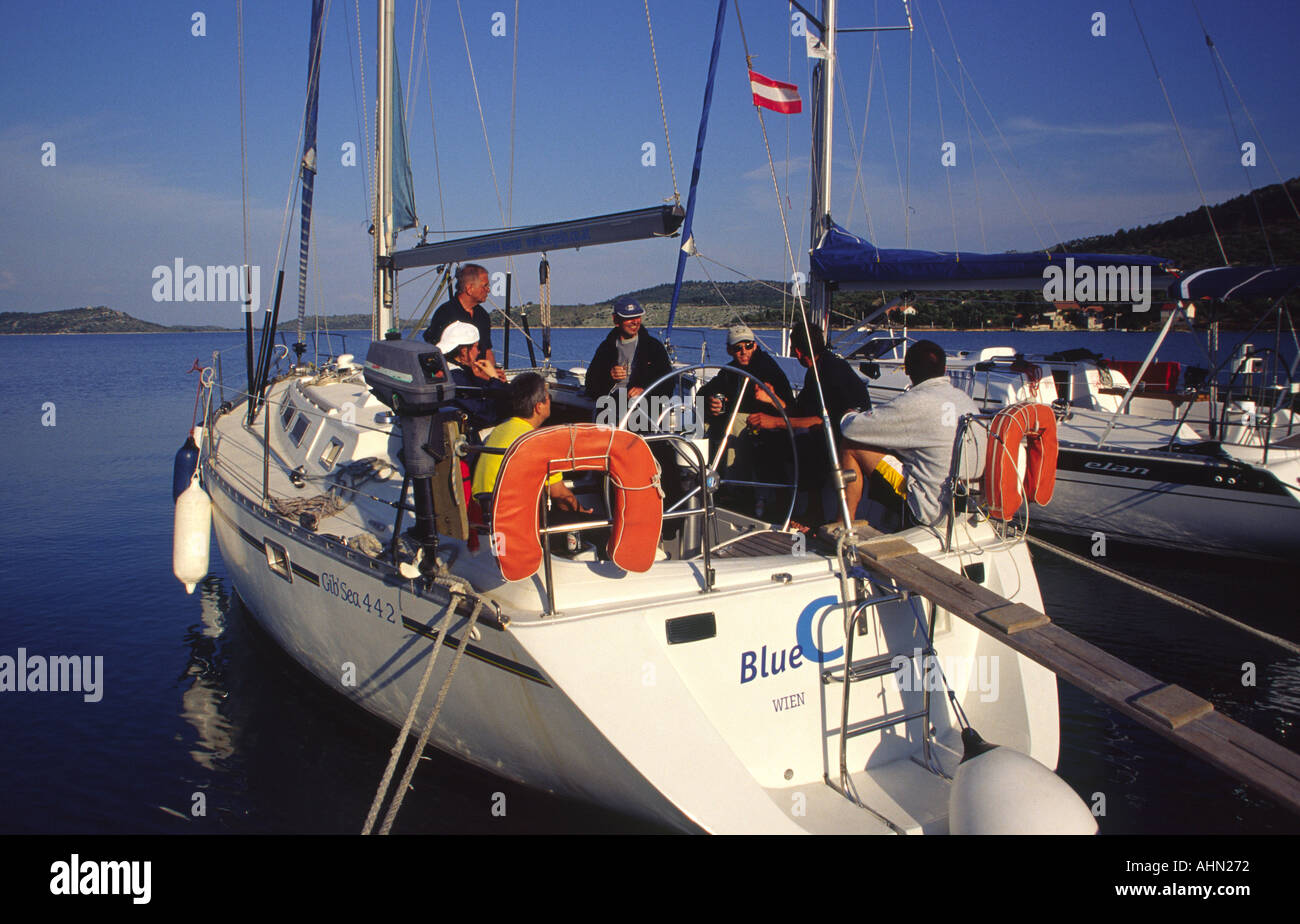 sailing boat with crew in harbour Stock Photo - Alamy
