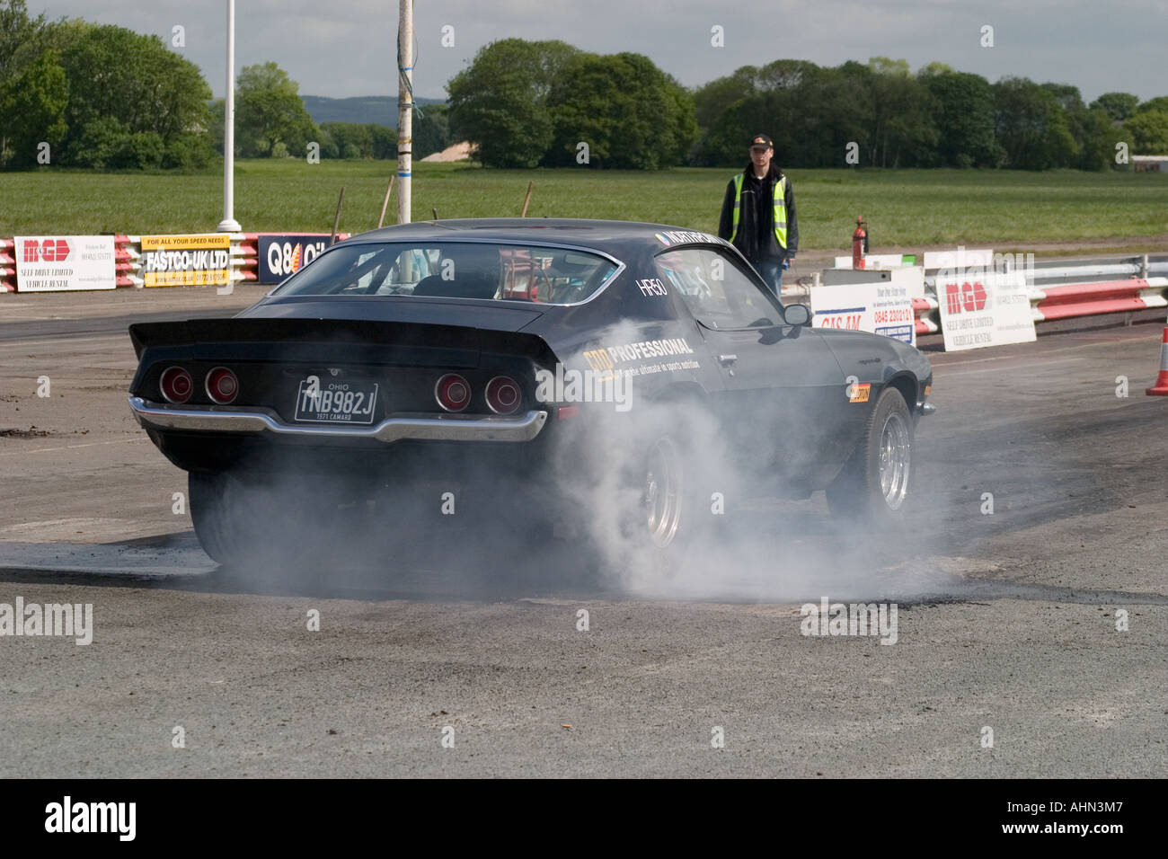 American car doing burn out before start of drag race Stock Photo - Alamy