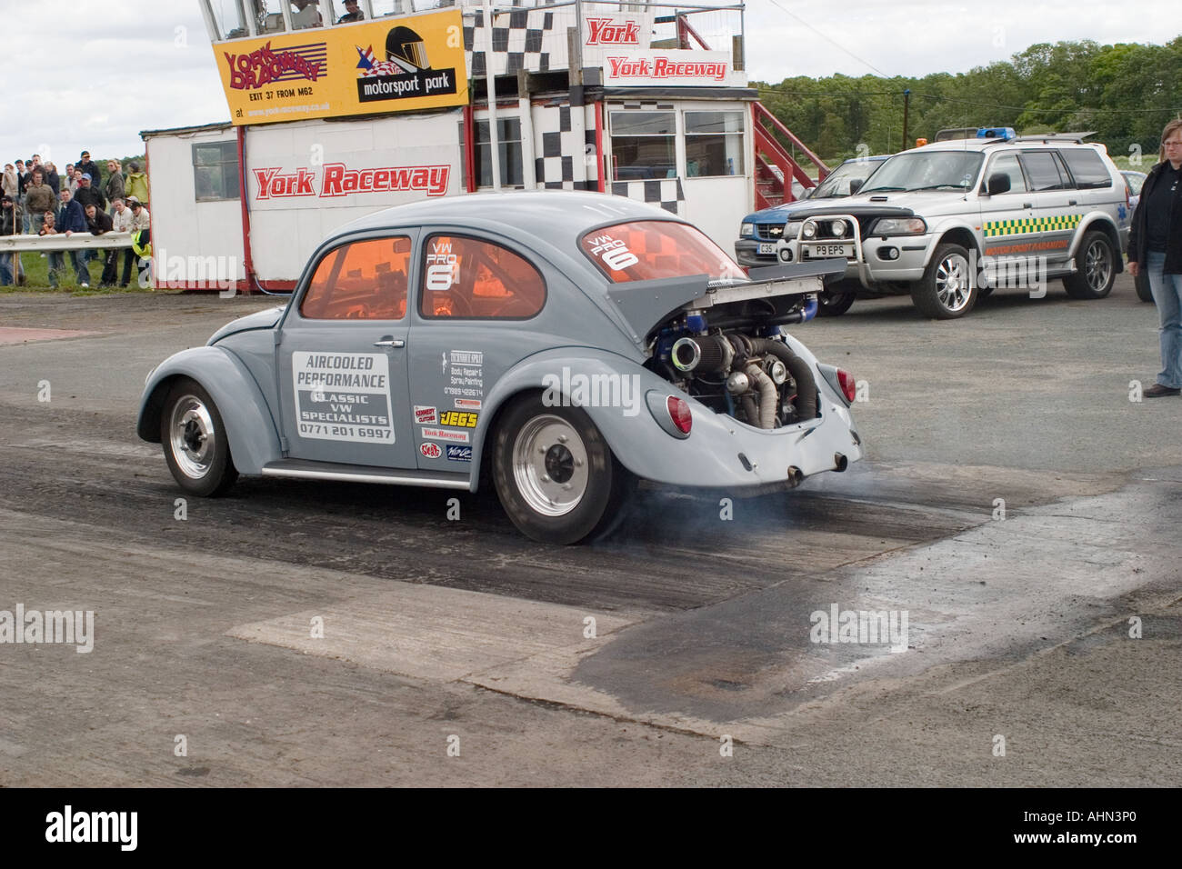 Heavily modified VW Beetle in burnout area at drag race Stock Photo - Alamy