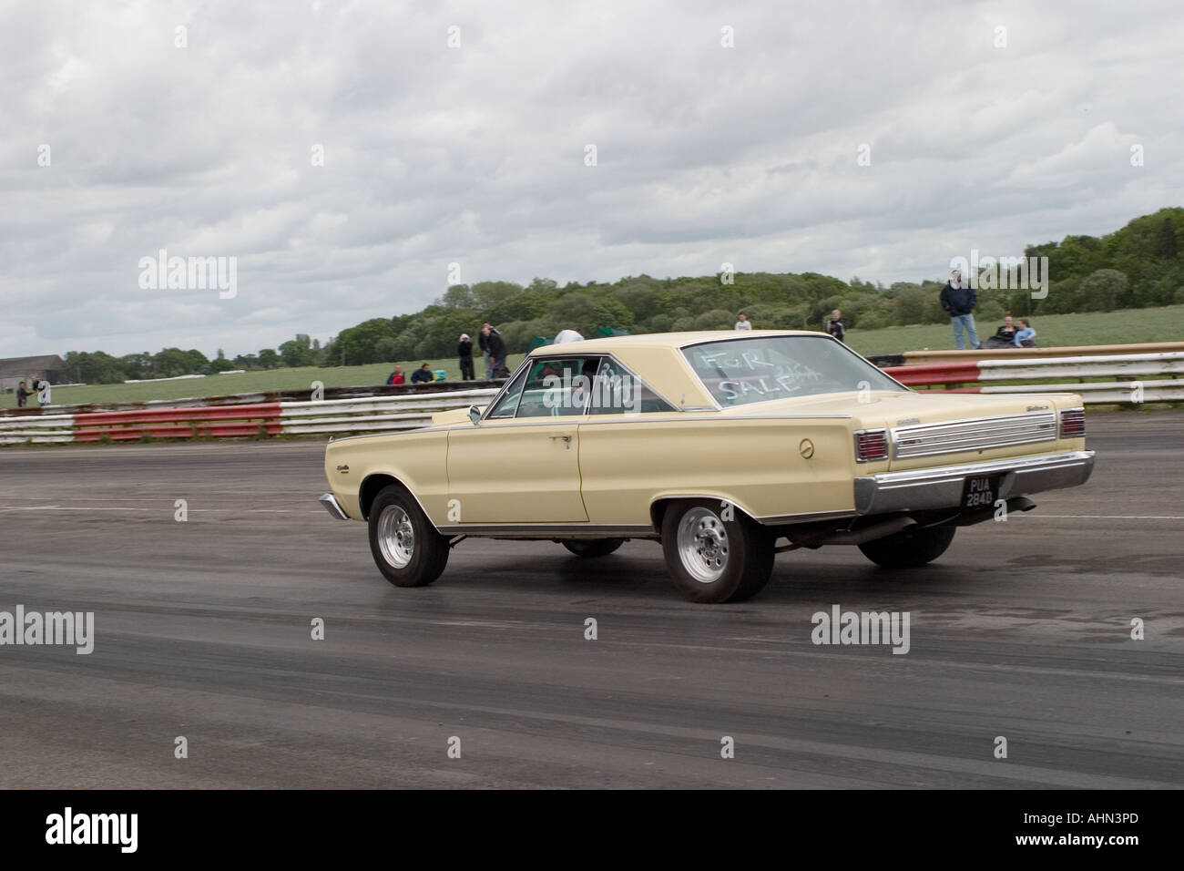 American muscle car leaving start line at drag race Stock Photo - Alamy