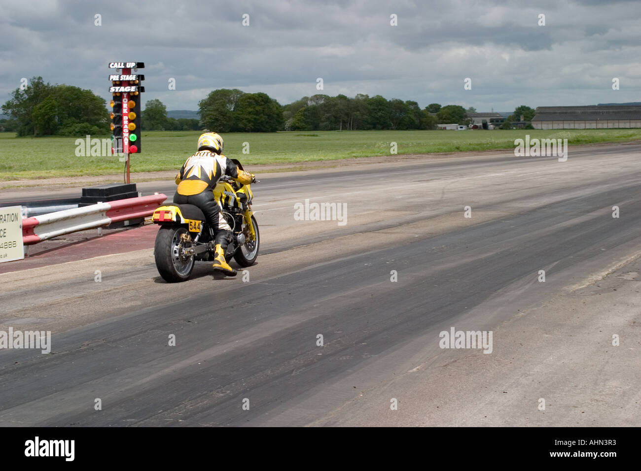 Yellow and black motorbike on startline at Melbourne Raceway North ...