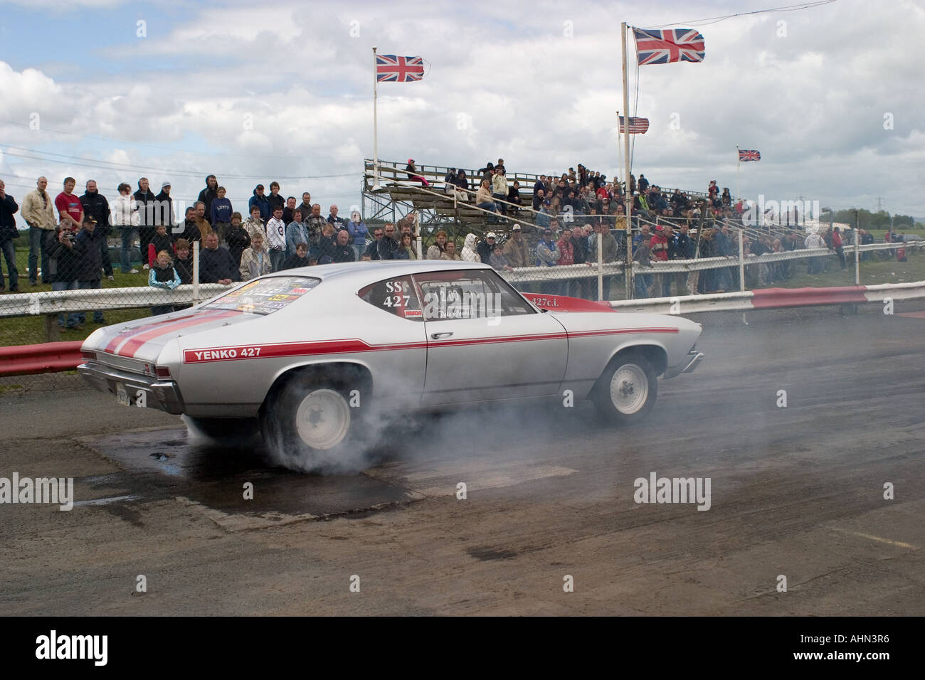 American car doing a burnout prior to start of drag race Stock Photo ...