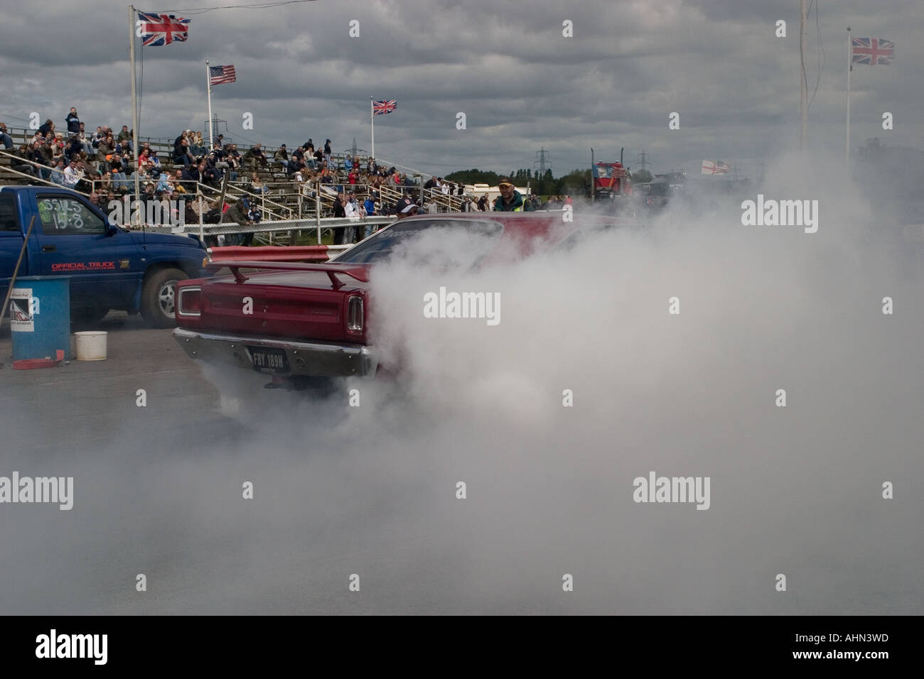 American car doing a burnout prior to start of drag race Stock Photo ...