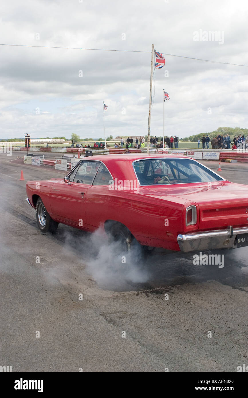 American car doing a burnout prior to start of drag race Stock Photo ...