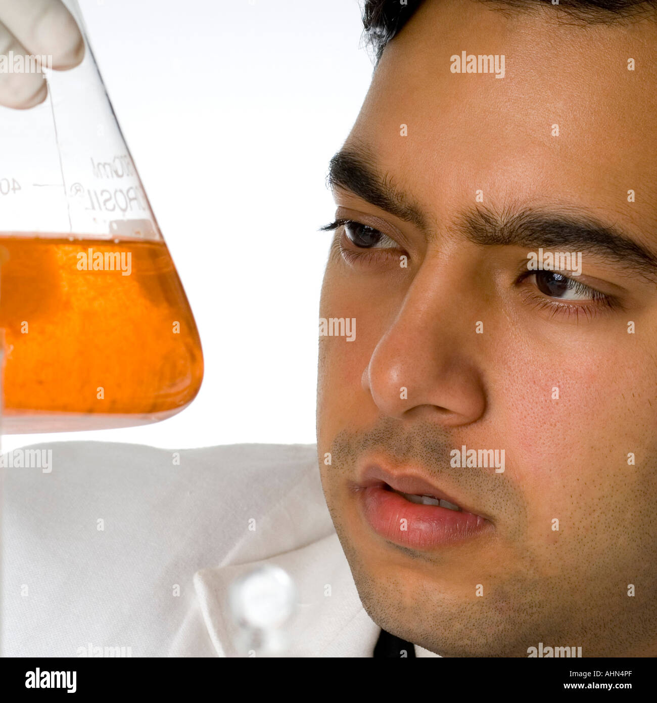 Close up of a scientist looking at a flask hi-res stock photography and ...