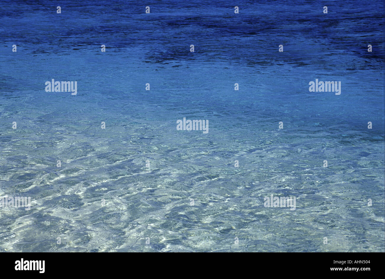Crystal blue sea Stock Photo - Alamy