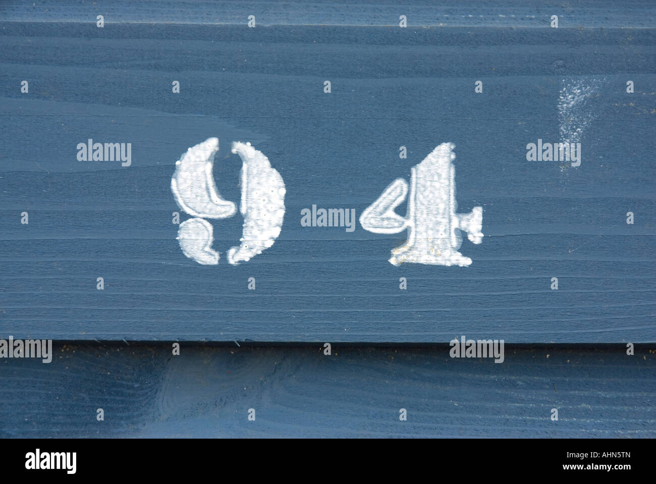 Number 94 stencilled onto wood Stock Photo - Alamy