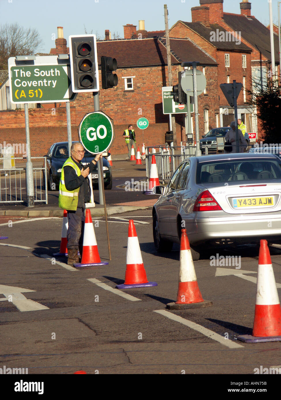 Manual Traffic Control during roadworks 1 Stock Photo - Alamy