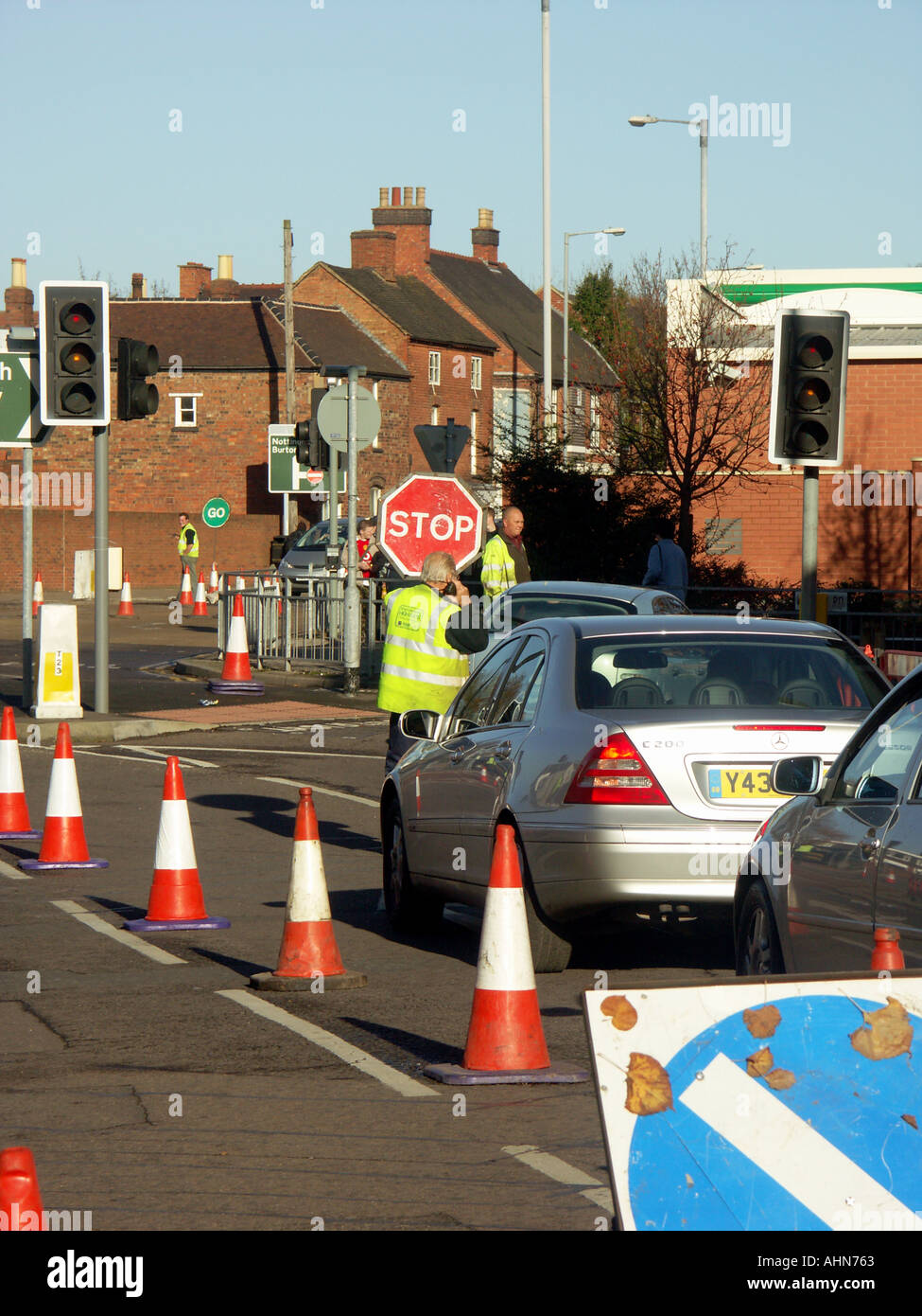 Manual Traffic Control during roadworks 3 Stock Photo - Alamy