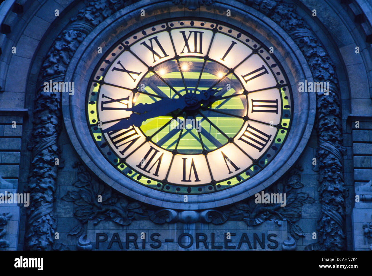 Paris The Musee d'Orsay building exterior clock at night.Belle Epoque ...