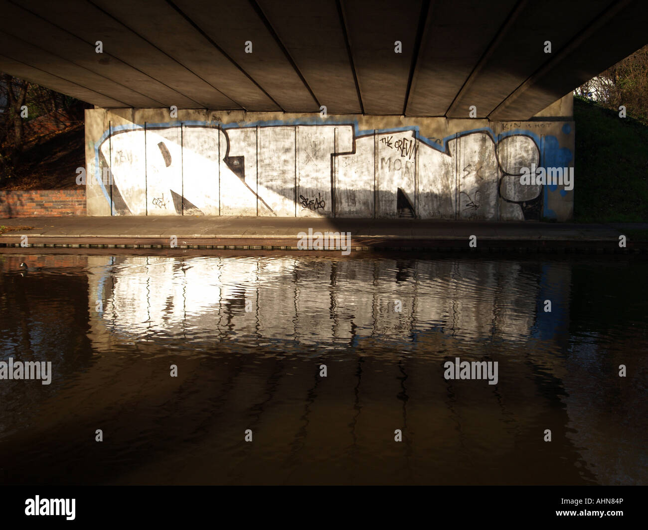 Graffiti reflected in the canal, under a bridge in Nottingham, UK Stock ...