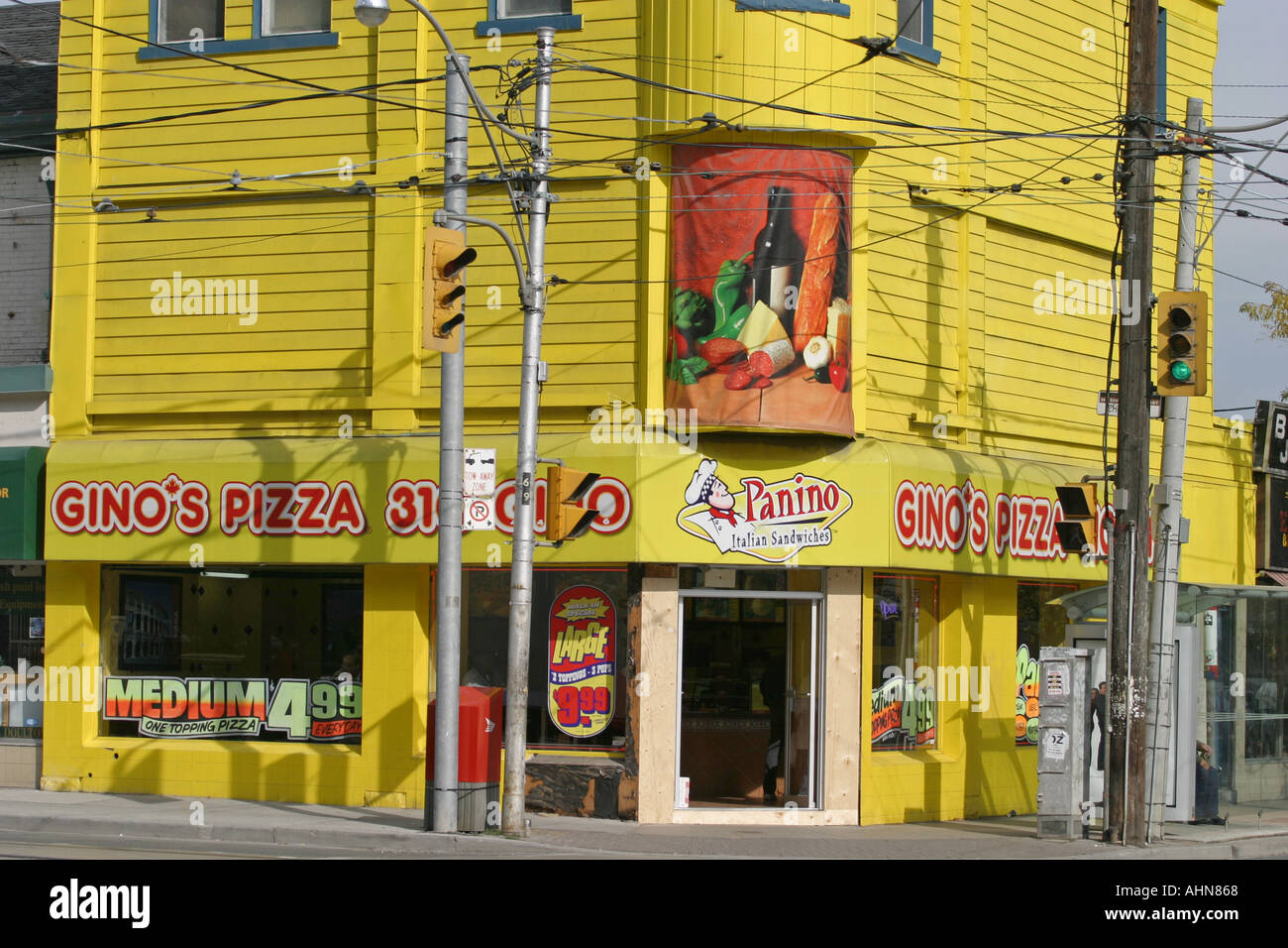 yellow building pizza shop Stock Photo - Alamy