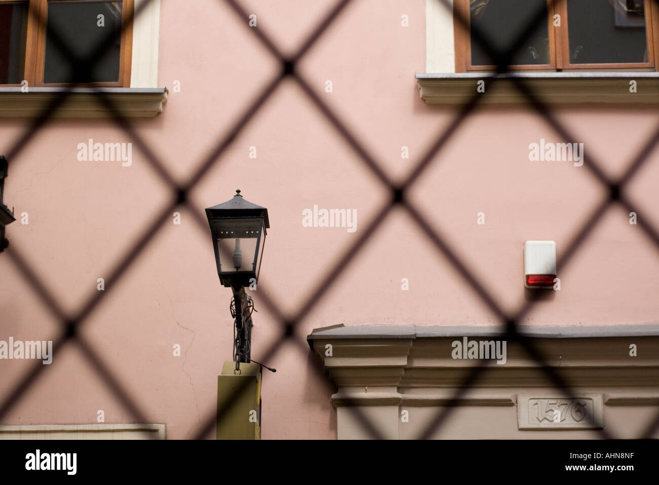 Lantern in old town behind window bars Stock Photo - Alamy