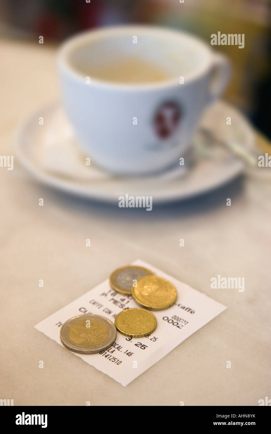 Money on top of check in cafe Stock Photo - Alamy