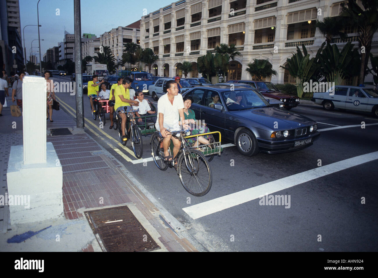 Trishaws tricycle rickshaws with passengers Singapore Stock Photo - Alamy