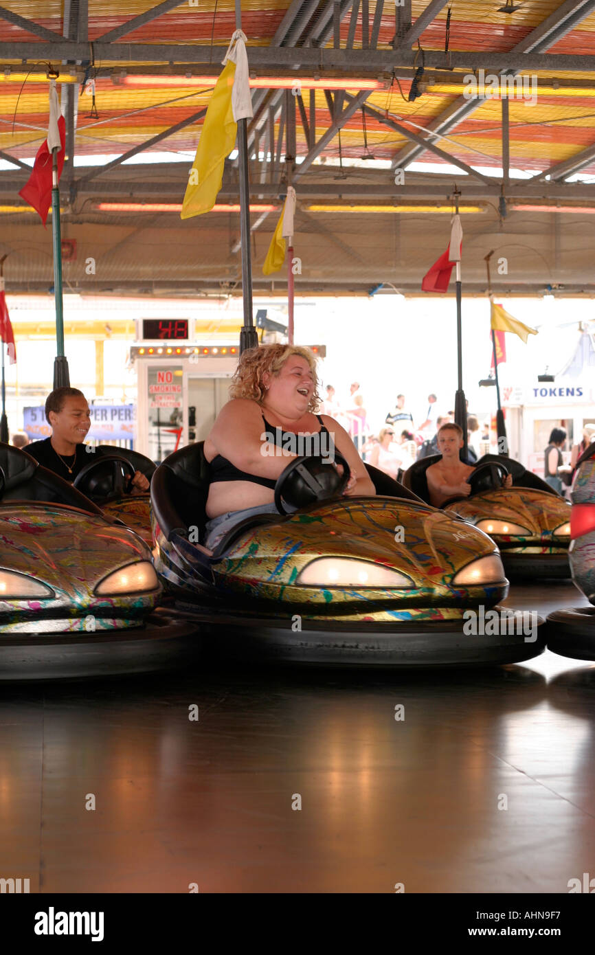 Large woman driving dodgem bumper car. Brighton, England Stock Photo ...