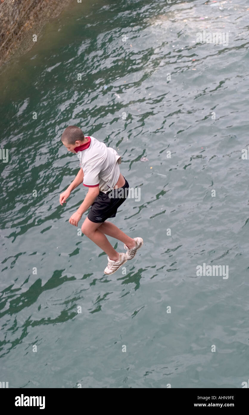 Child diving off pier hi-res stock photography and images - Alamy
