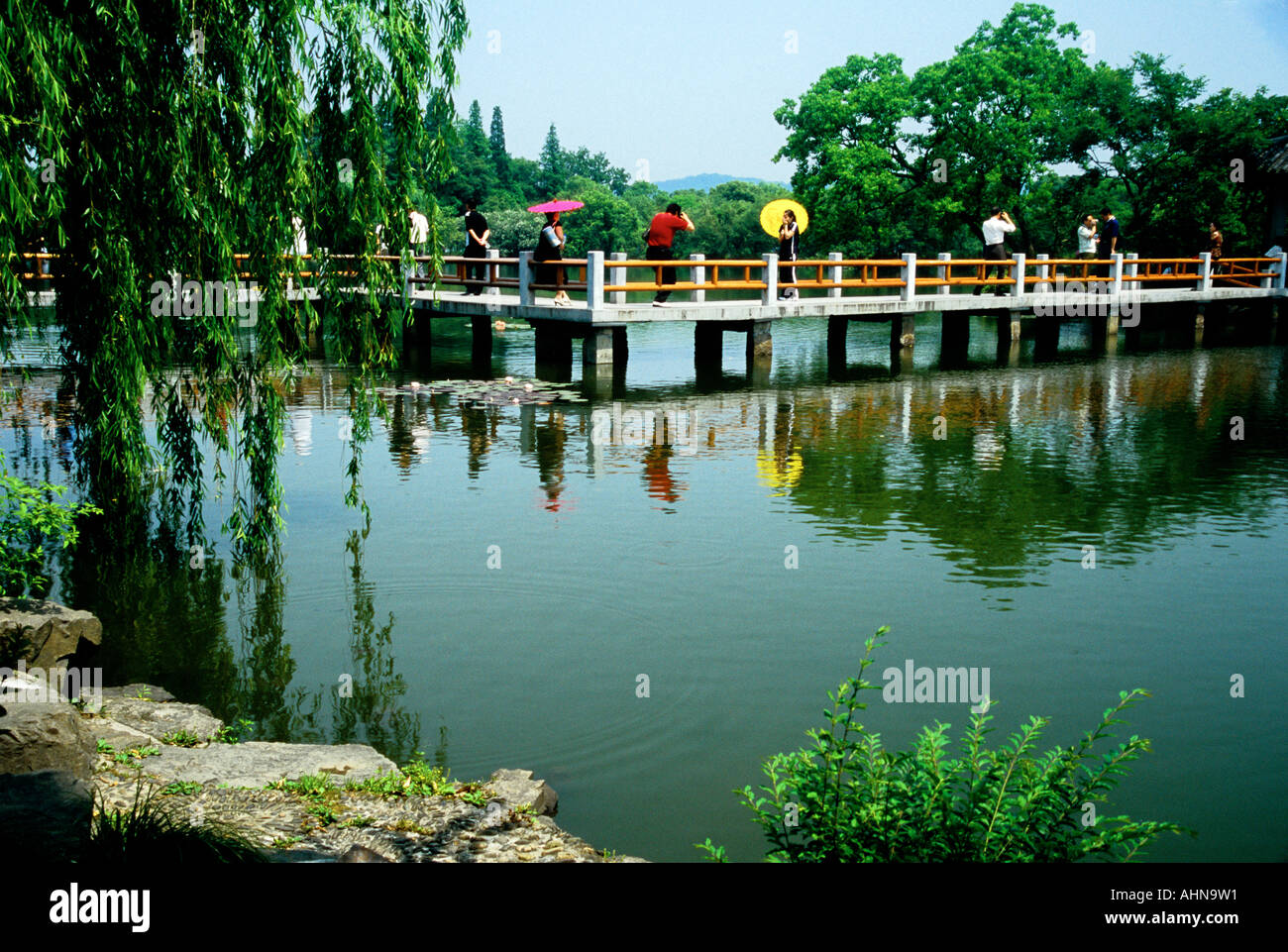 Hangzhou's West Lake bridge across lotus pond on Island of Small Seas ...