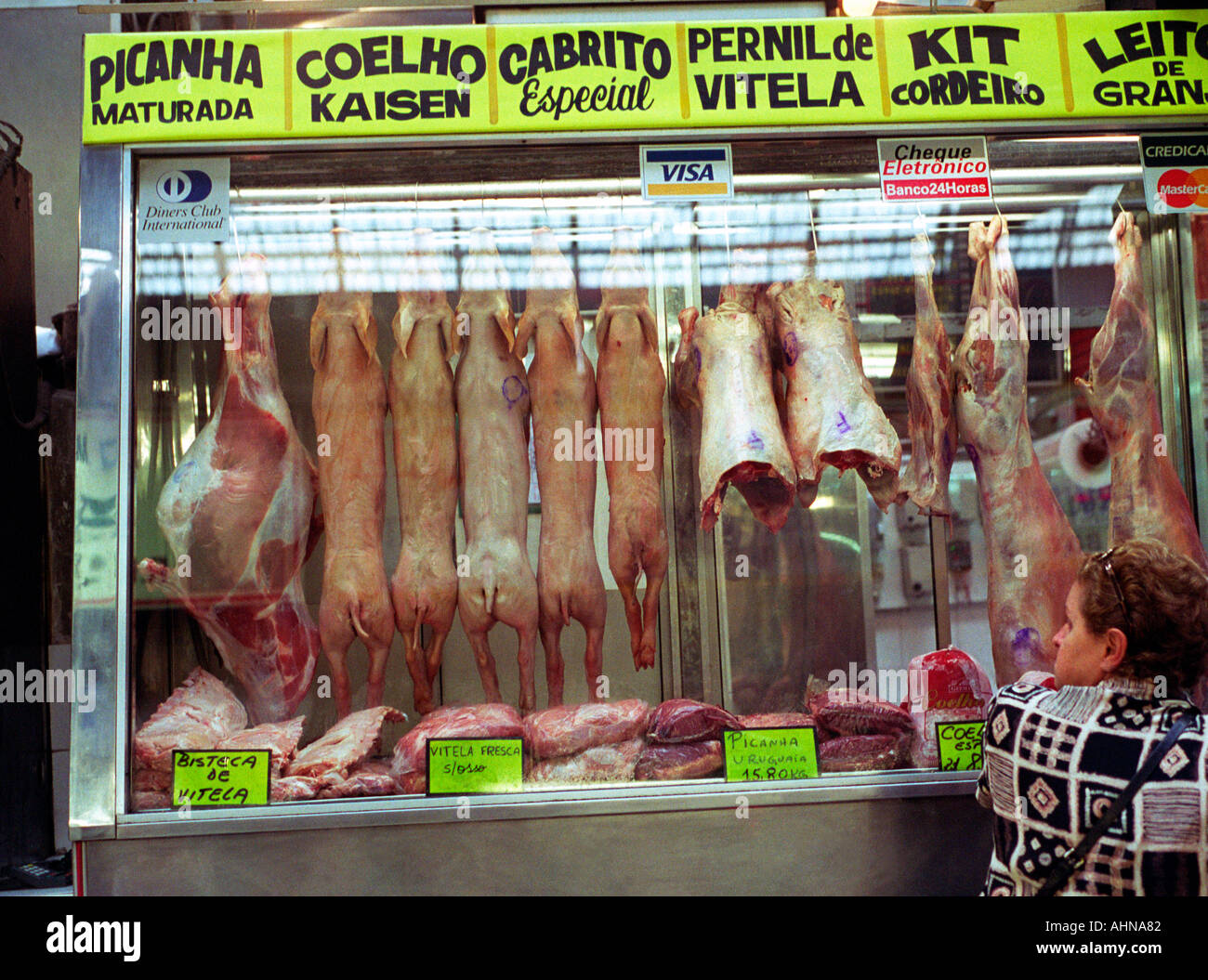 Woman looking at meat on display in a Brazilan market Stock Photo - Alamy
