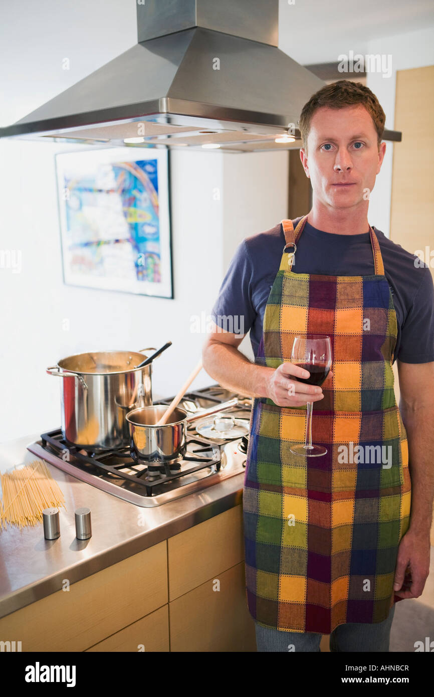 Couple cooking kitchen serious hi-res stock photography and images - Alamy