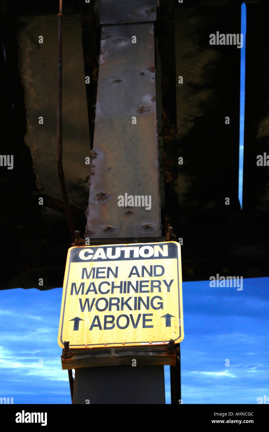 Caution Men and machinery Working Above Stock Photo - Alamy
