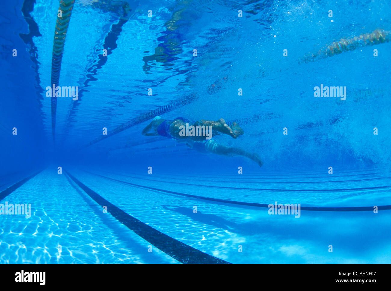 2 women diving into swimming pool Stock Photo - Alamy