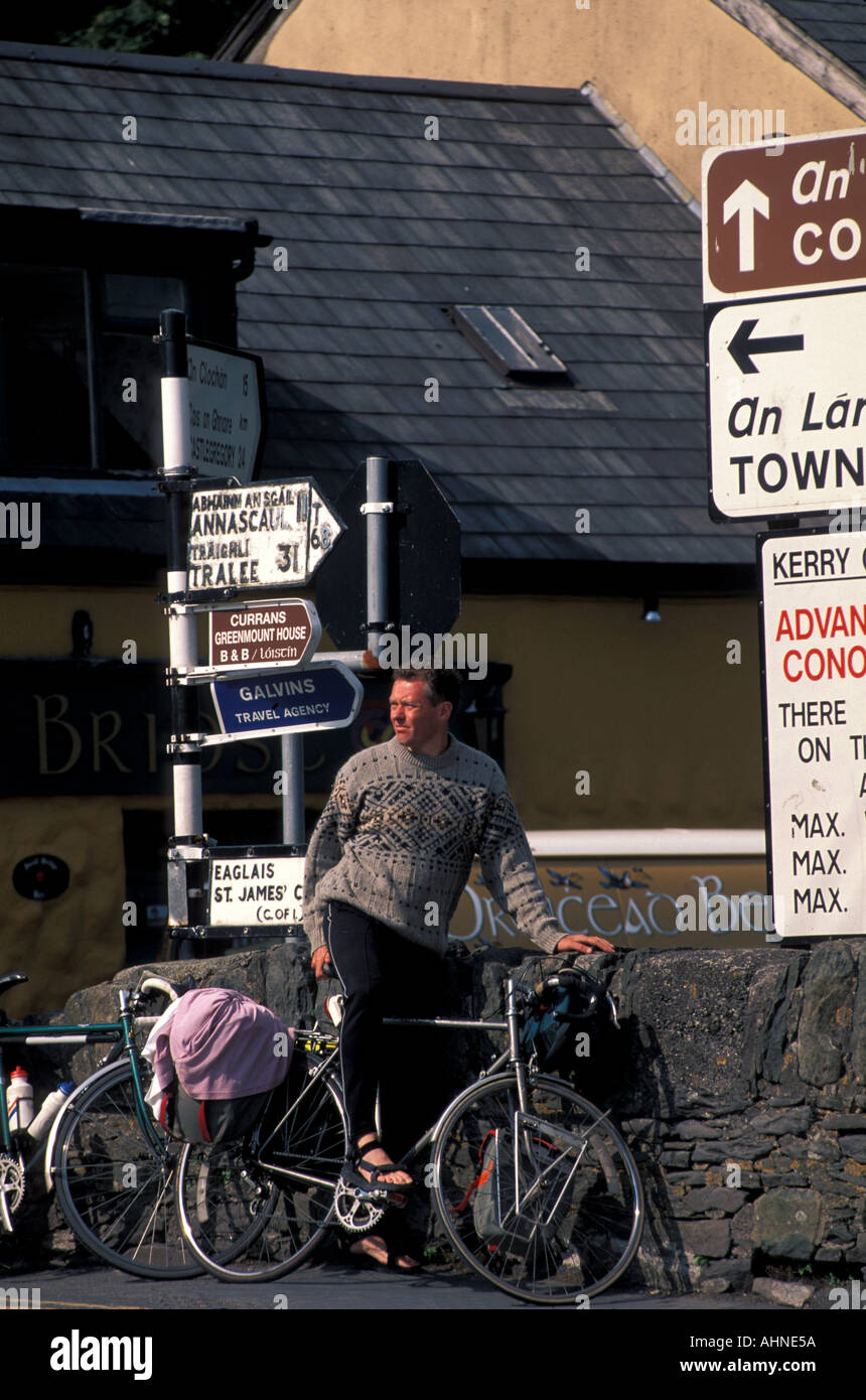 Ireland Dingle Town Cyclist standing beside road signs Stock Photo - Alamy