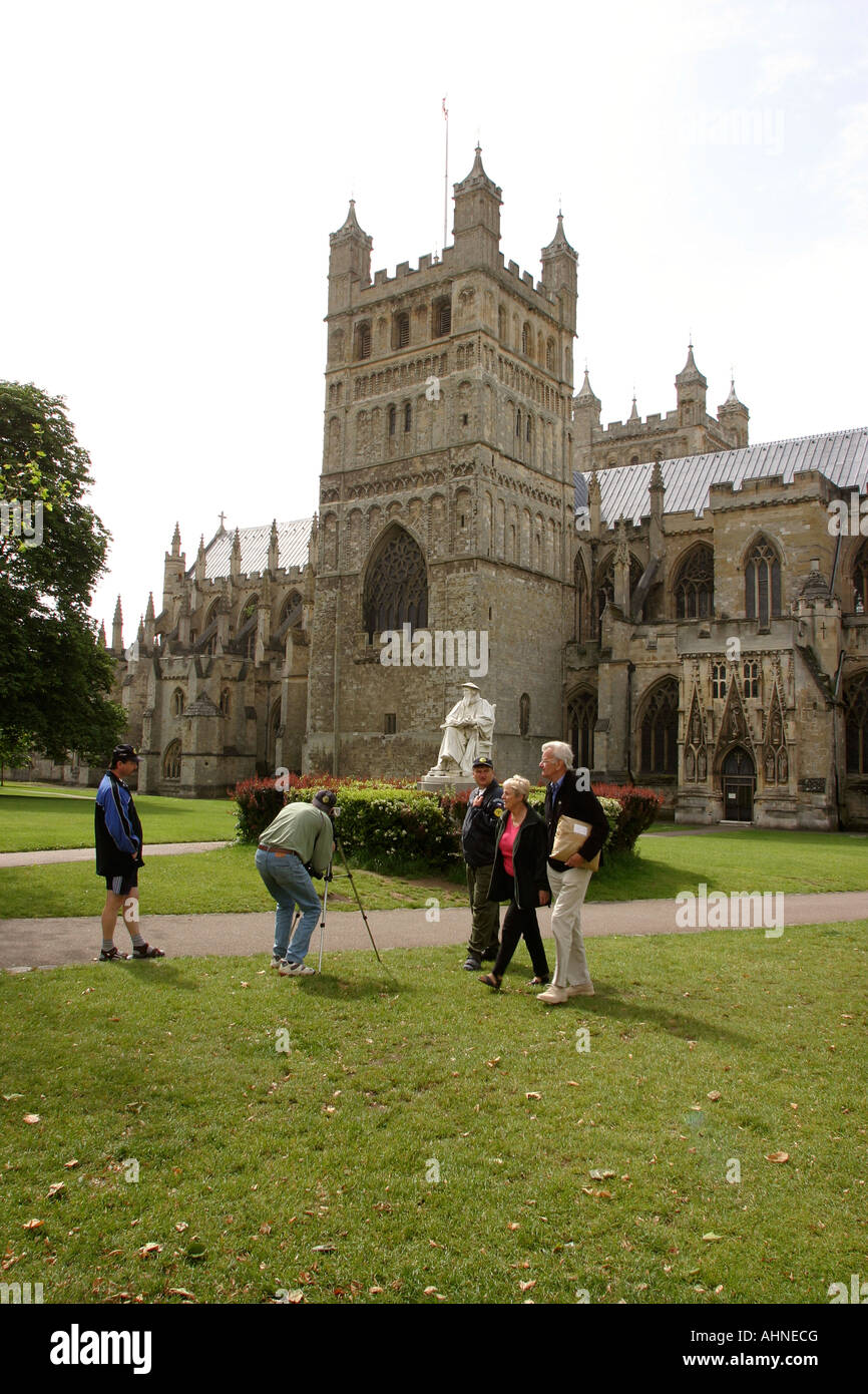 UK Devon Exeter Cathedral visitor photographing the north tower Stock ...