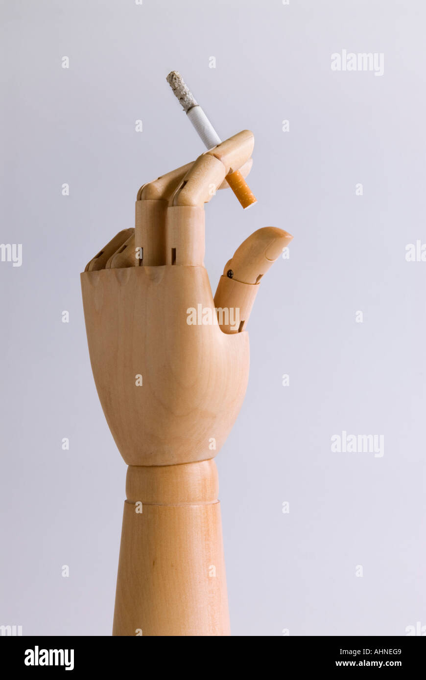 wooden hand with lighted cigarette Stock Photo - Alamy