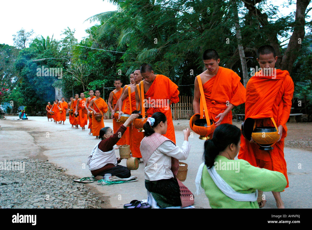 Buddhist monks early alms walk hi-res stock photography and images - Alamy