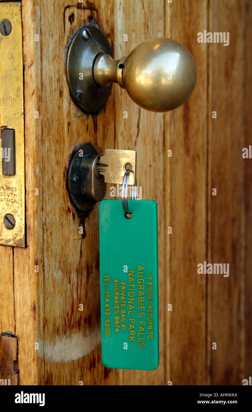Key in door lock Stock Photo - Alamy