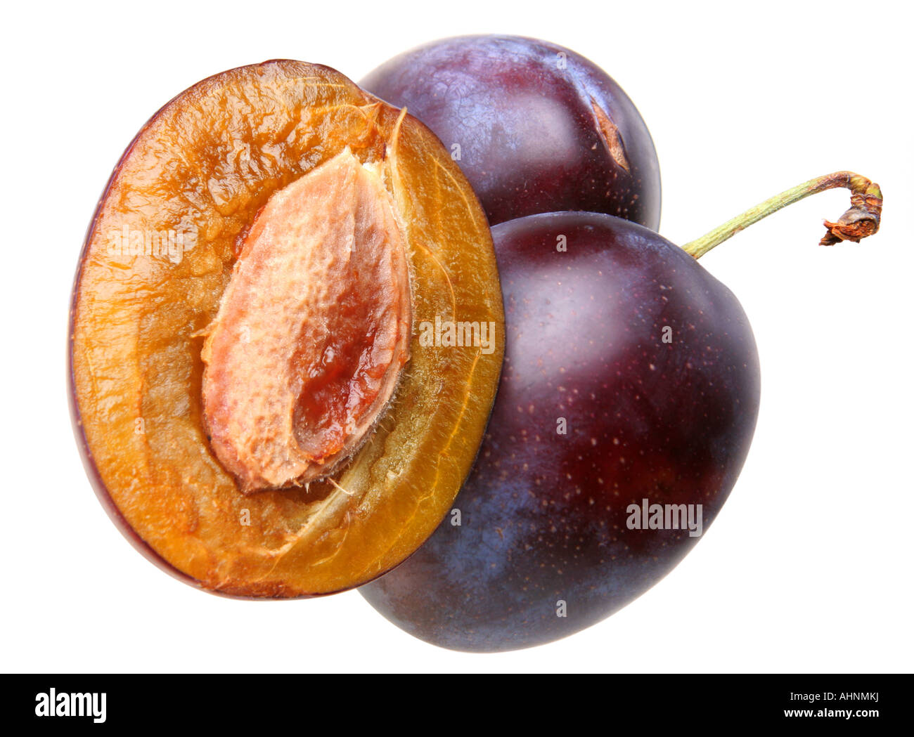 Closeup slice plum with plum on white background Stock Photo - Alamy