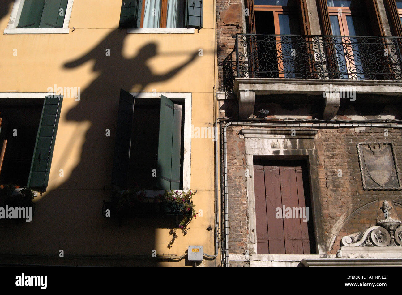 Shadow of angel on building facade Venice Italy Stock Photo - Alamy
