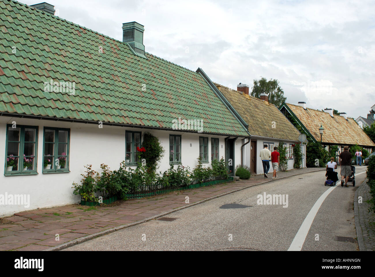 pretty cottages line the side streets of Bastad in southern Sweden ...