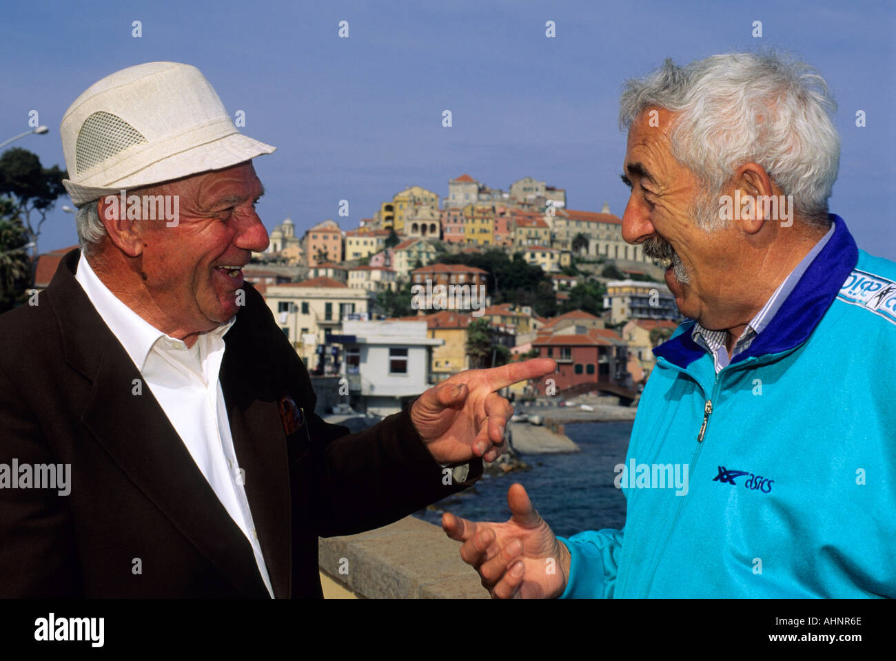 Italian men talking at Imperia Italy using hands in animated ...