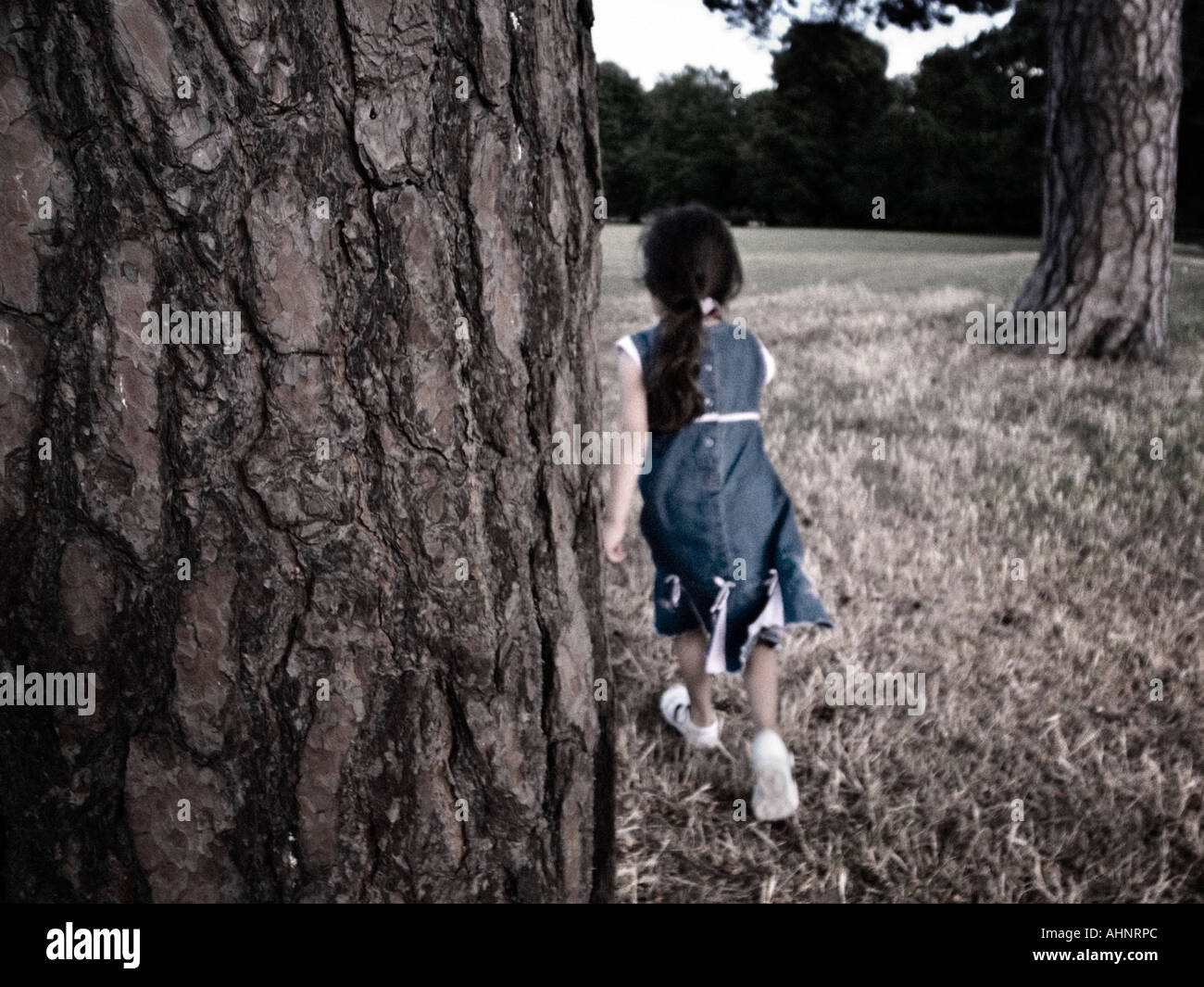child playing hide and seek Stock Photo - Alamy
