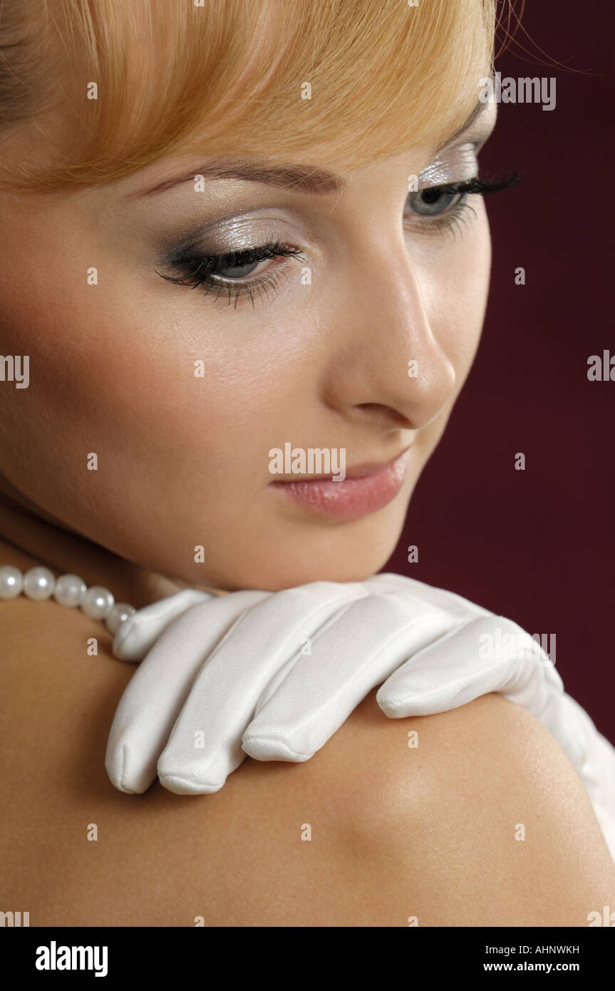 Beautiful young woman in white gloves Stock Photo - Alamy