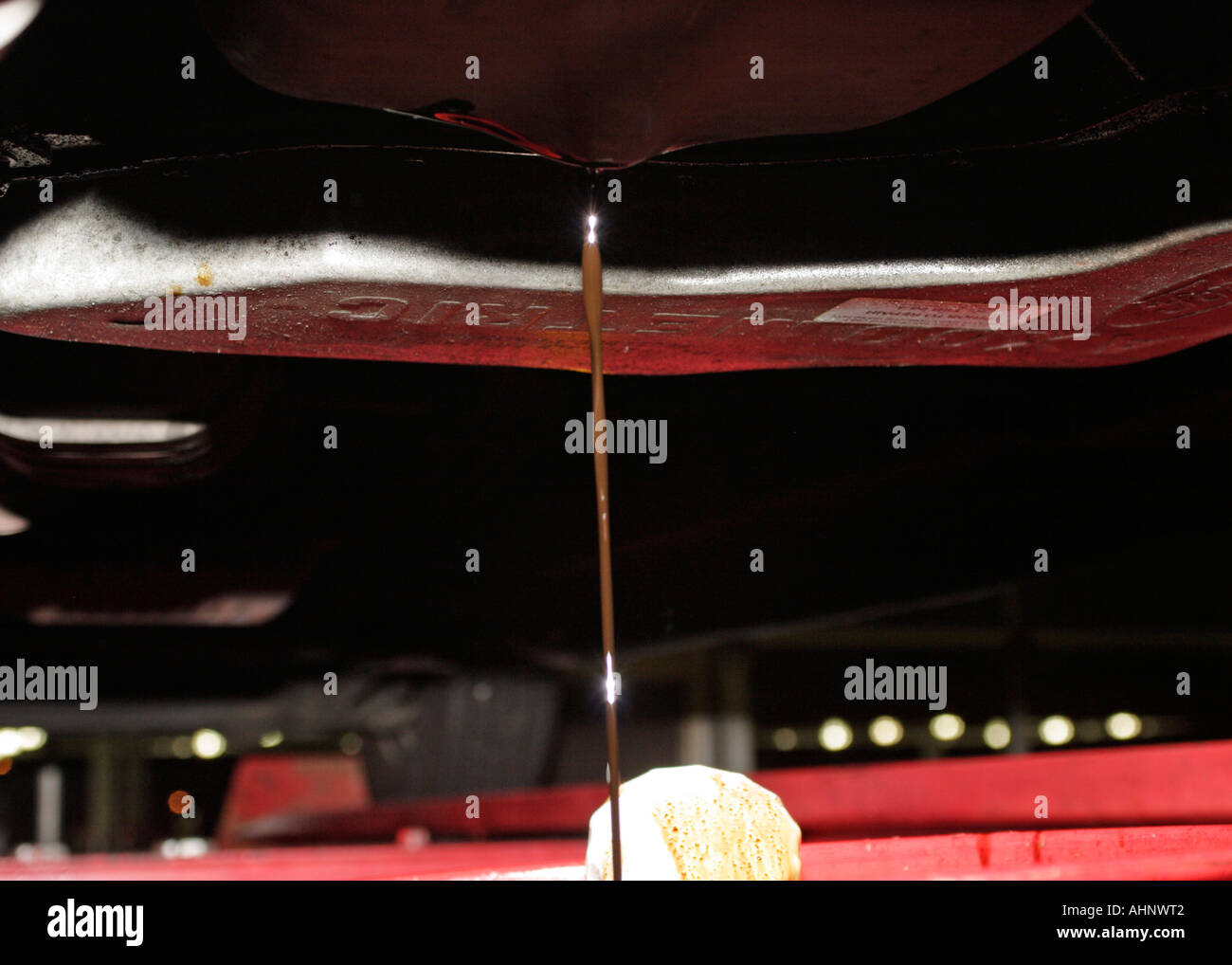 Draining motor oil from engine Stock Photo - Alamy