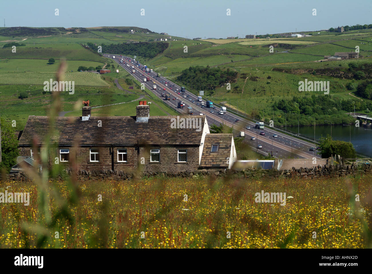 M62 Motorway at Scammonden overlooking moorland farmhouse Stock Photo ...