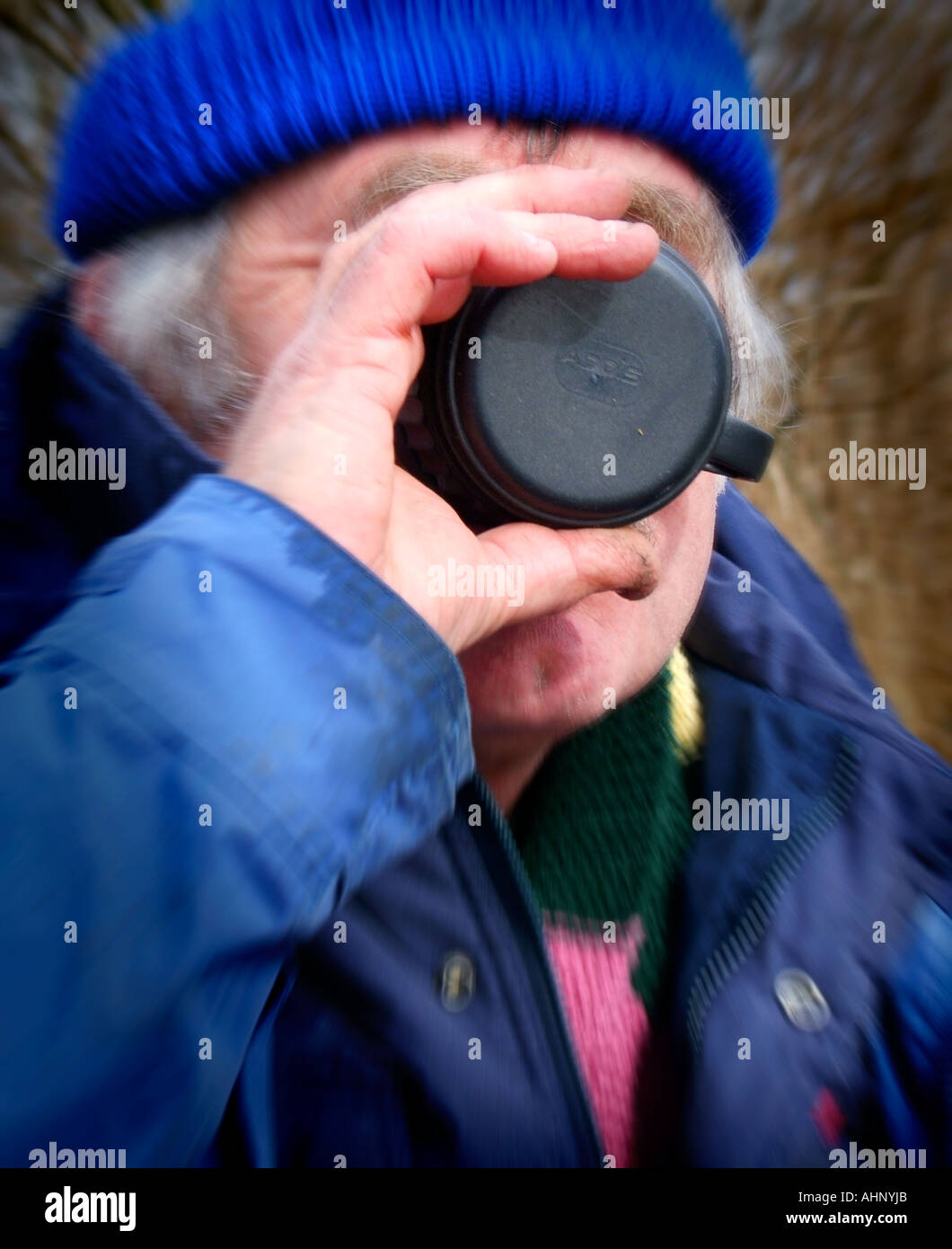 man drinking from thermos flask cup Stock Photo - Alamy