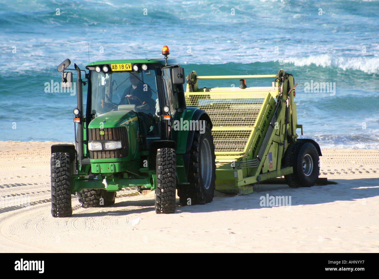 Sand tractor collecting rubbish on Bondi Beach Stock Photo - Alamy